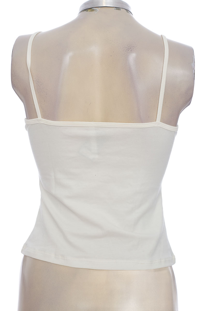 Top / Camiseta color Blanco - Leonisa talla S de Segunda Mano | Closeando
