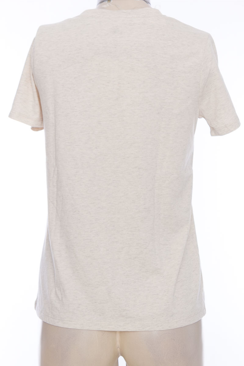 Top / Camiseta color Beige - Disney talla XS de Segunda Mano | Closeando